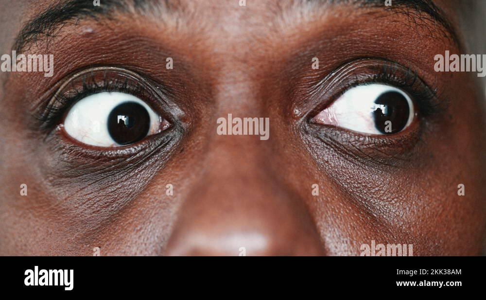 Shocked African man close-up eyes looking in HORROR Stock Video Footage - Alamy
