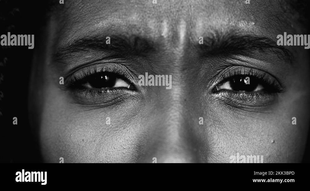Upset black girl macro close-up. Monochrome African ethnicity feel ...