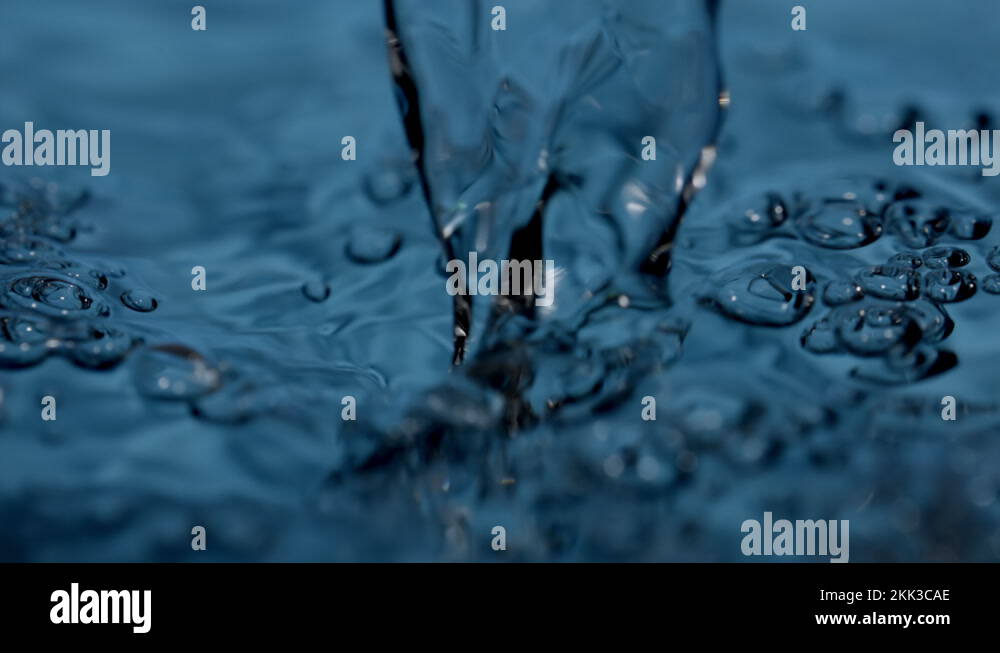 Continuous Water Pouring Down and Smaller Bubbles Surrounding the ...