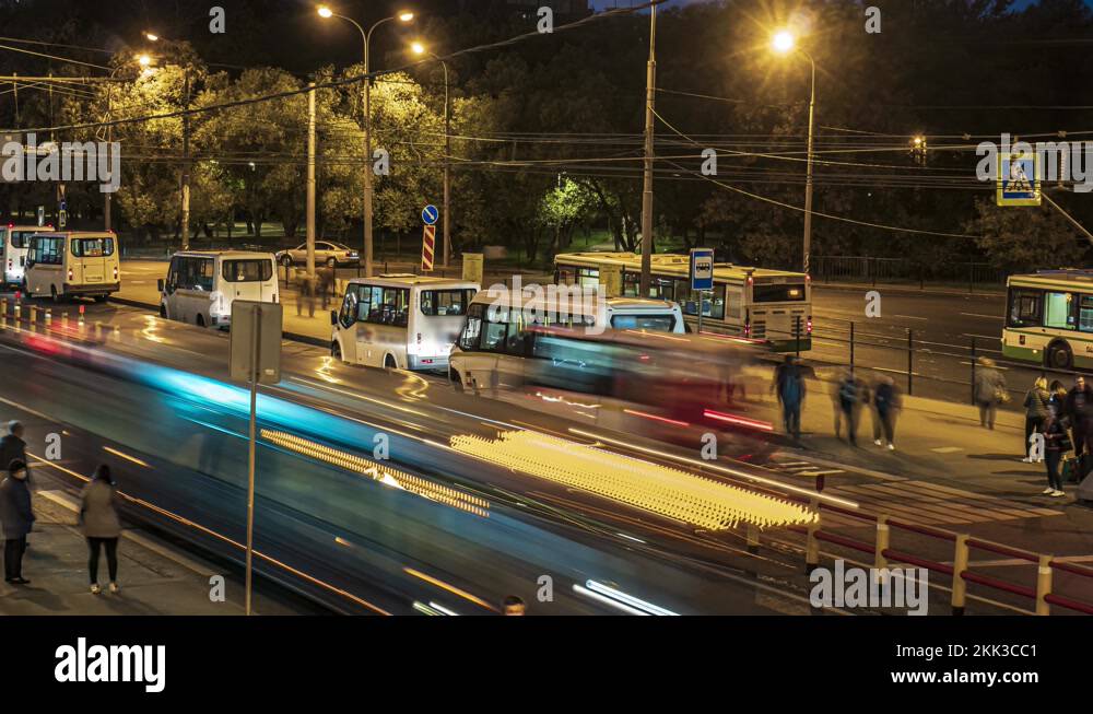 Passengers waiting and boarding buses at the bus terminal, time lapse ...