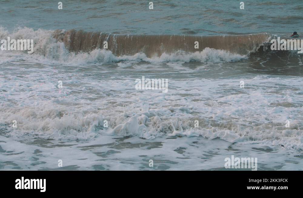 foamy waves crashing in slow motion on the beach Stock Video Footage ...