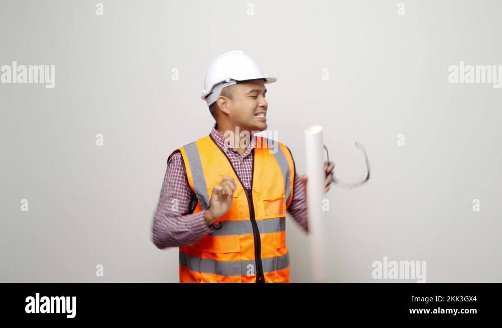 Asian mechanic dancing with music on isolated white background. 4k ...