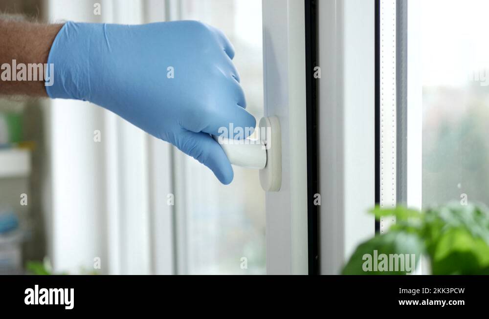 Hand of a Man Opening in Swing Mode a Window from the Office Stock ...