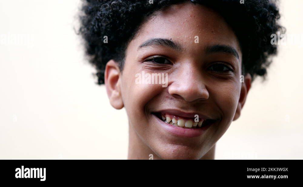 Happy mixed race young boy smiling Stock Video Footage - Alamy