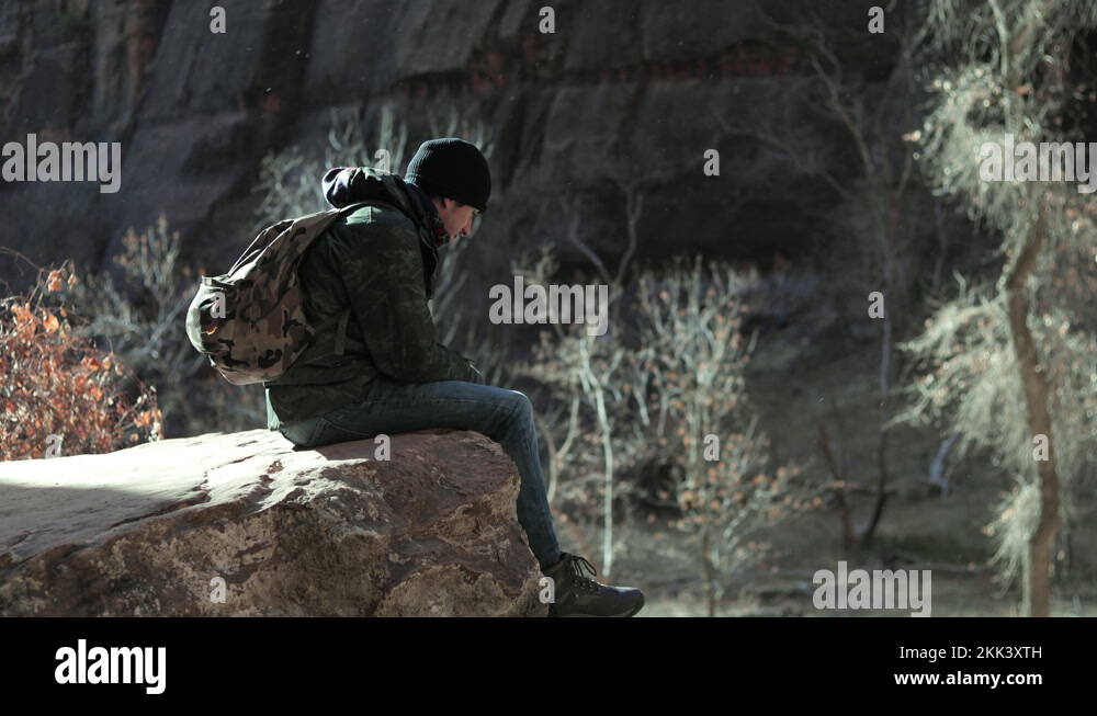 Man sitting on rock ledge Stock Videos & Footage - HD and 4K Video ...