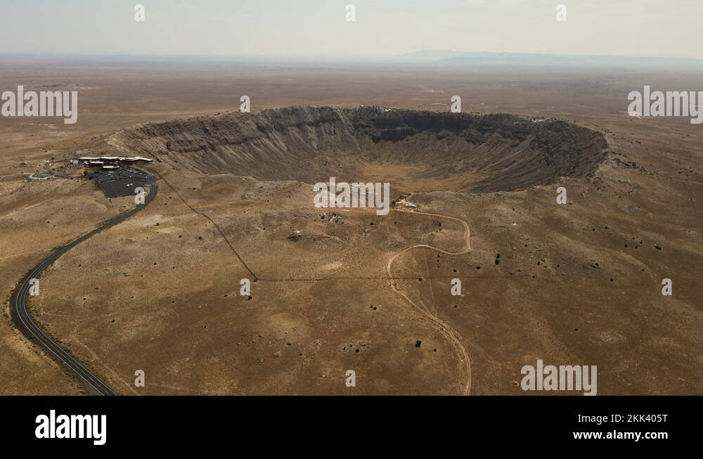 Cinematic aerial flyover of prehistoric impact crater in the Southwest ...