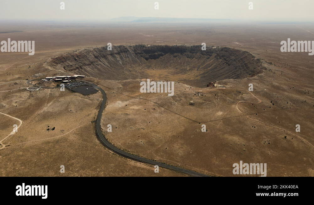 Cinematic aerial flyover of prehistoric impact crater in the Southwest ...