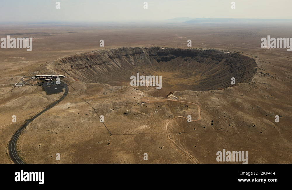 Cinematic aerial flyover of prehistoric impact crater in the Southwest ...