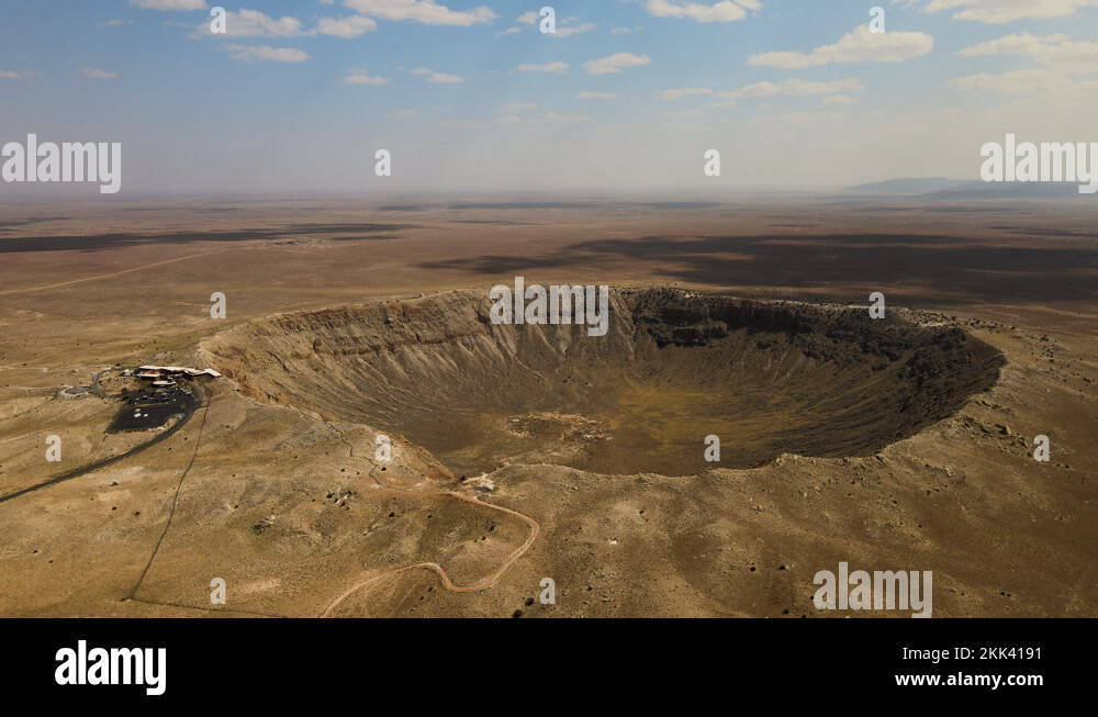 Cinematic aerial flyover of prehistoric impact crater in the Southwest ...