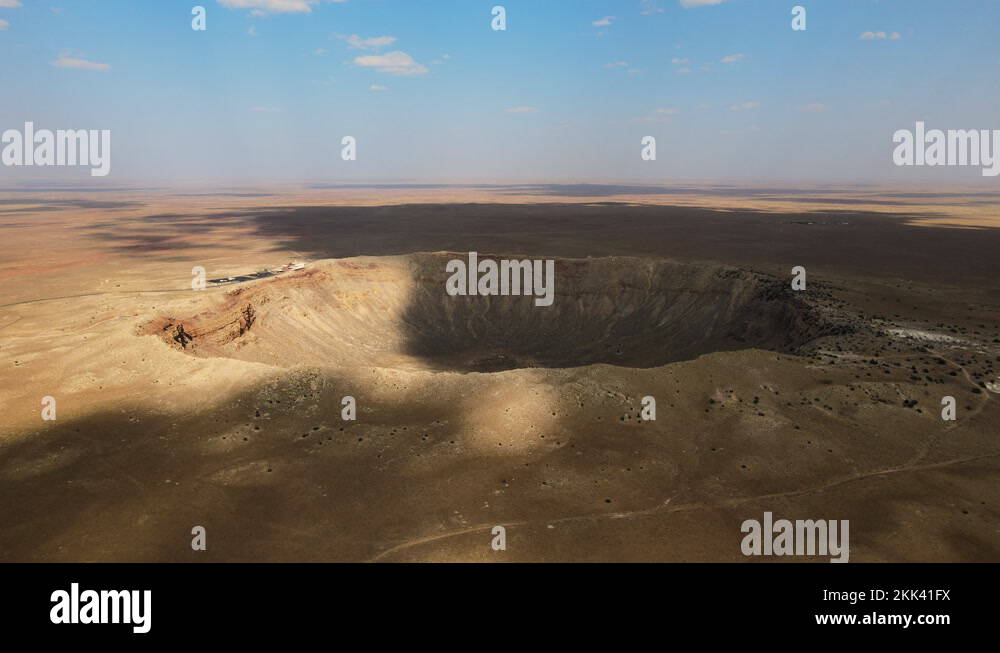 Cinematic aerial flyover of prehistoric impact crater in the Southwest ...