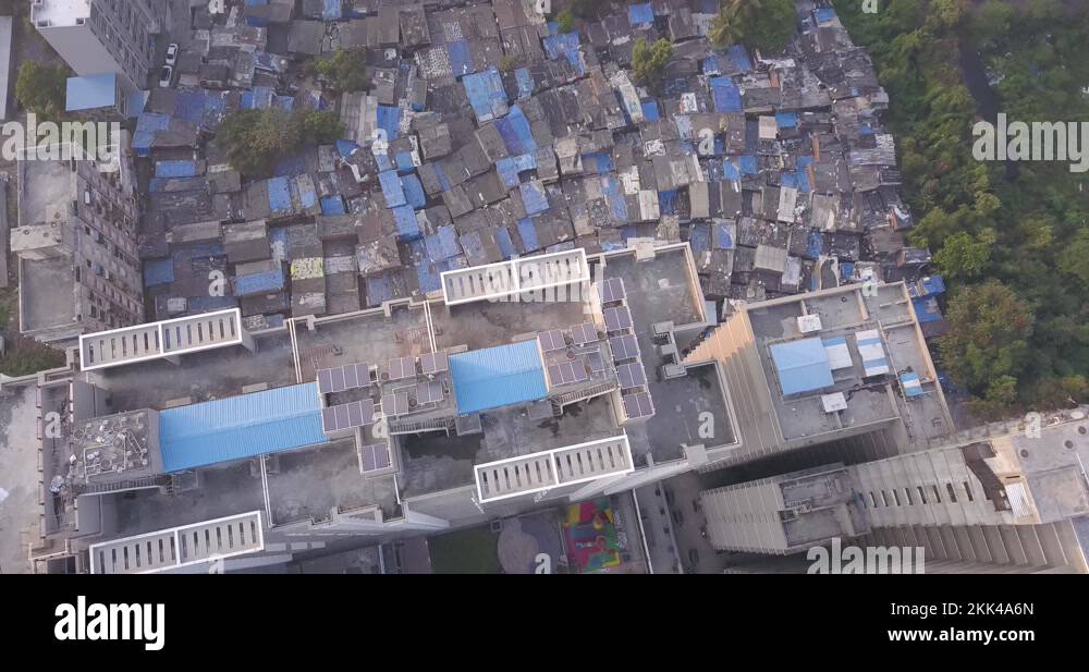 Top-Down View Of Apartment Building With Slum Housing - Poor ...