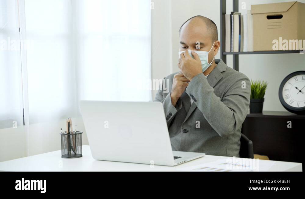 Work from home concept. Asian male business wear a suit at workplace ...