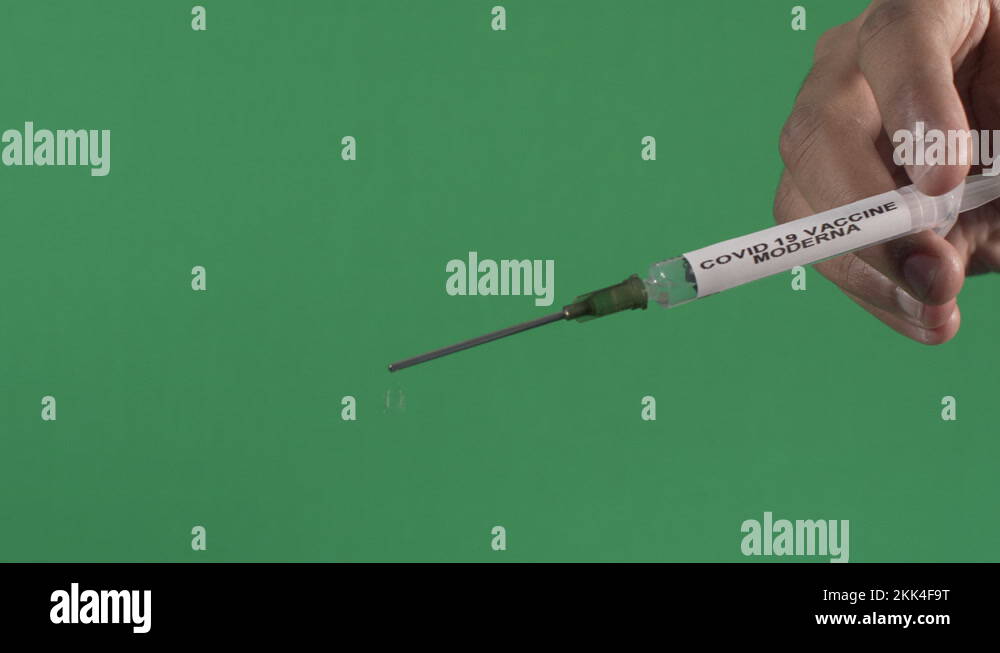Coronavirus Covid 19 Moderna Vaccine Dripping From Syringe. Green ...