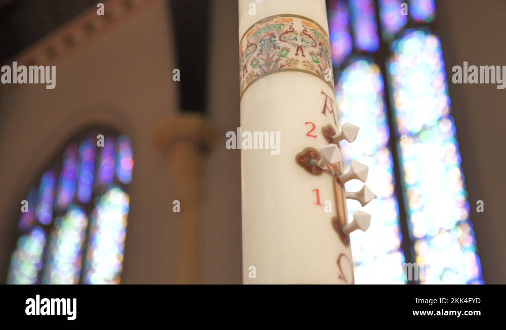 Paschal Candle With Alpha and Omega Symbols in Interior of Catholic ...