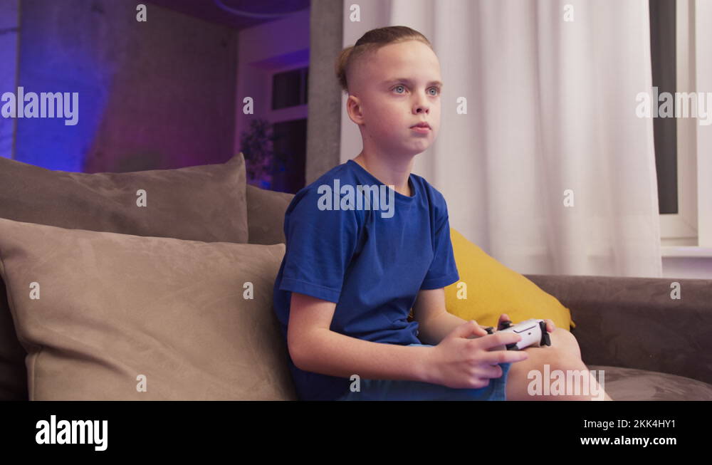 Excited kid playing video games on modern console next gen 2020, new ...