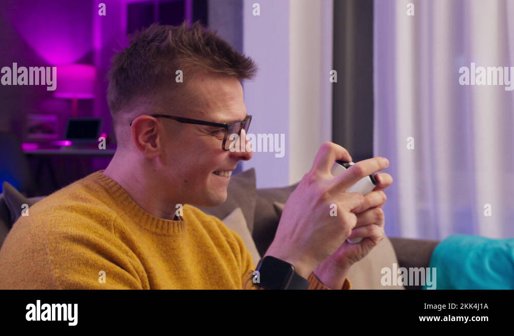 Excited man playing video games on modern console next gen 2020, new ...