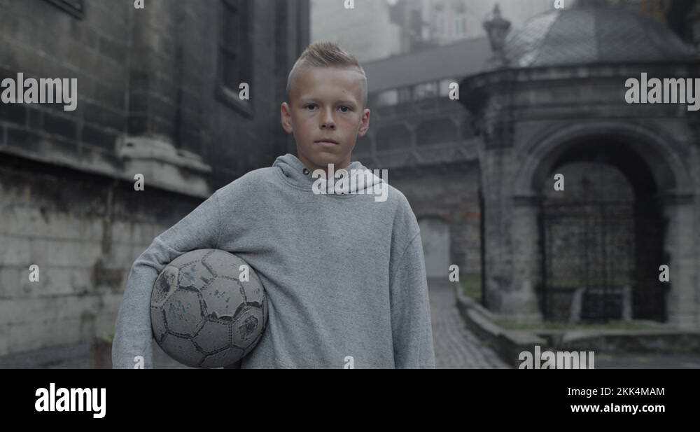 Kid holding football Stock Videos & Footage - HD and 4K Video Clips - Alamy