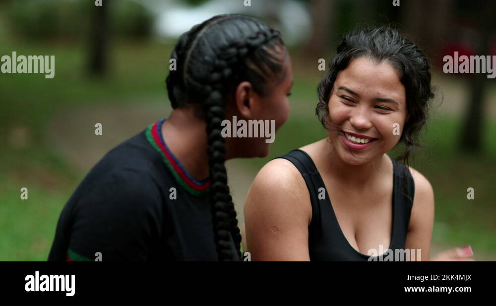 Two diverse friends laughing and smiling together. Mixed race ...