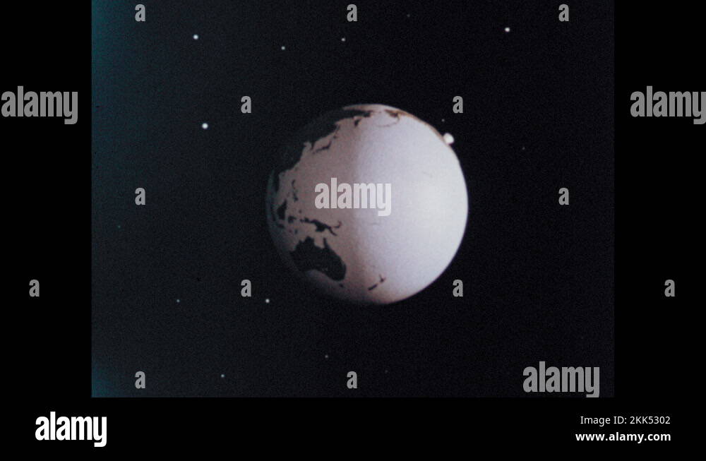 1960s: Model of Earth rotates on axis in space with pin in location ...