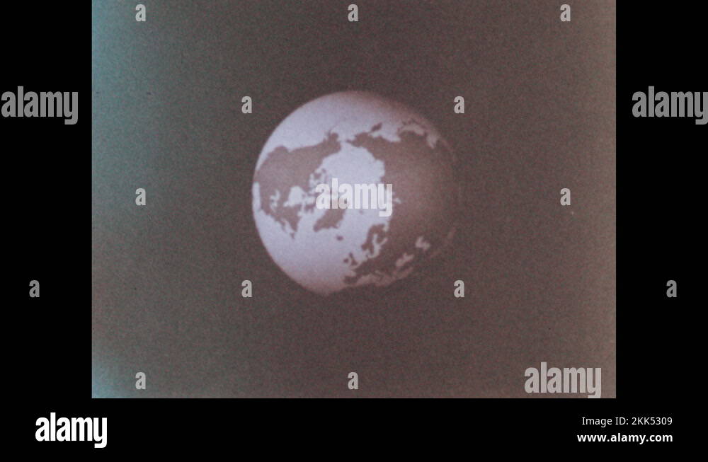 1960s: Model of Earth rotates on axis in space. Looking down on model ...