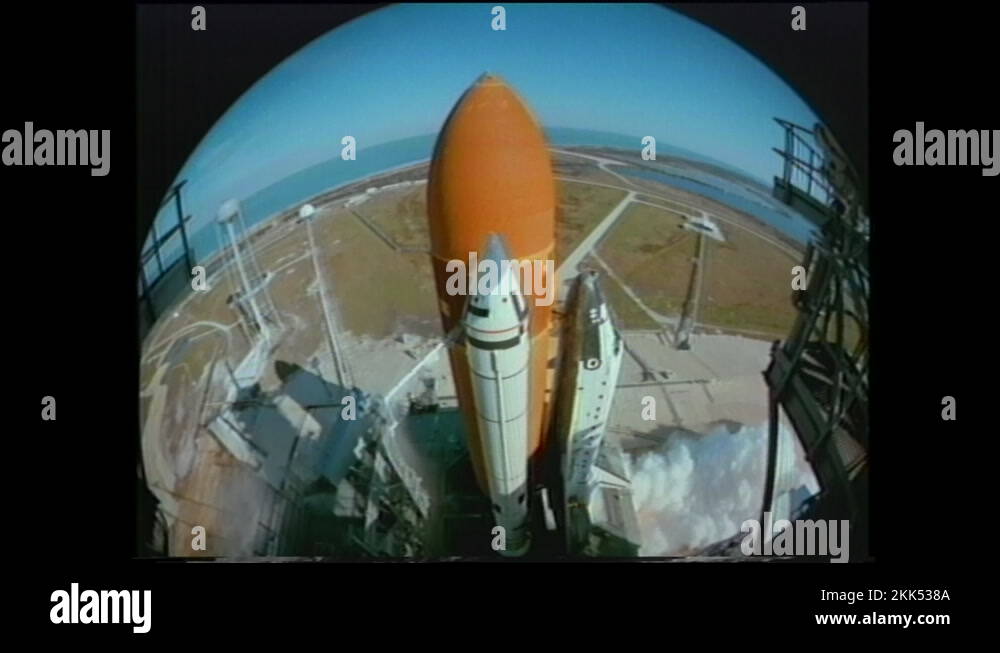 1990s: Rocket with space shuttle attached launches. Shuttle orbits ...