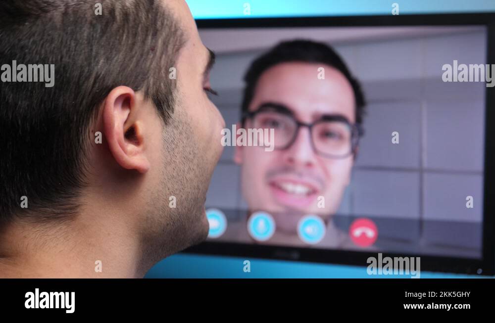 Video Call Between Two Men On a Computer Screen Stock Video Footage - Alamy