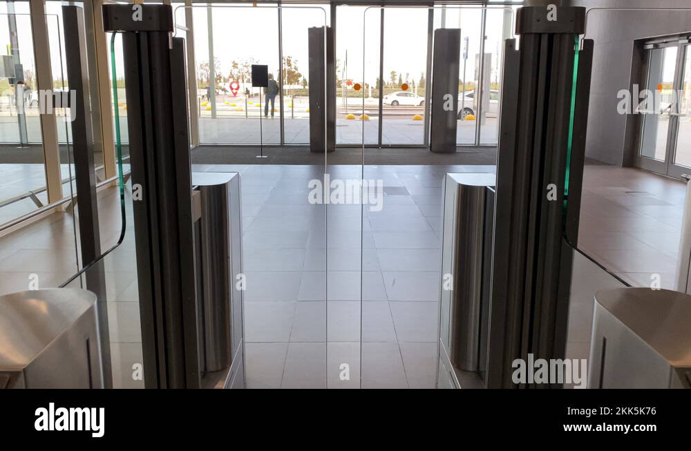 Passenger passing through the security gate at the airport, exit lane ...