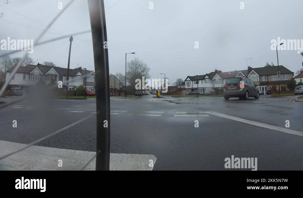 Low Angle POV Cycling Around Mini Roundabout In The Rain In Ruislip ...