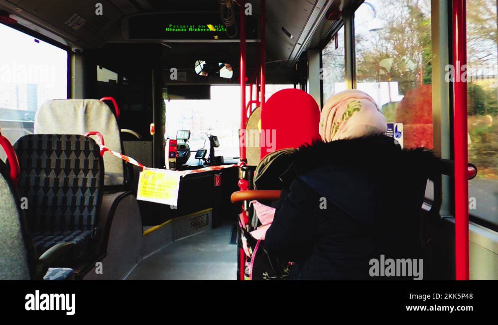 Woman travels near window on a bus. Female is traveling on public Stock ...