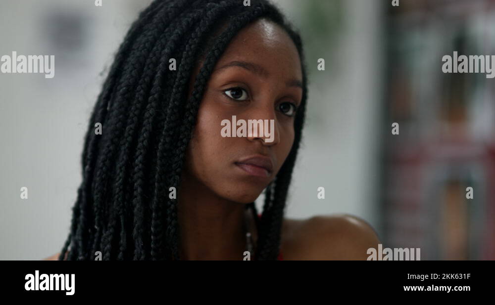 African black teen girl applying make-up in front of mirror Stock Video ...