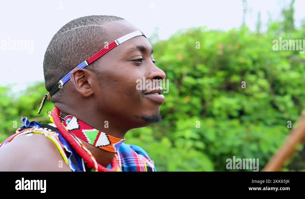 African man jamming, nodding head,while listening to music in Kenya ...