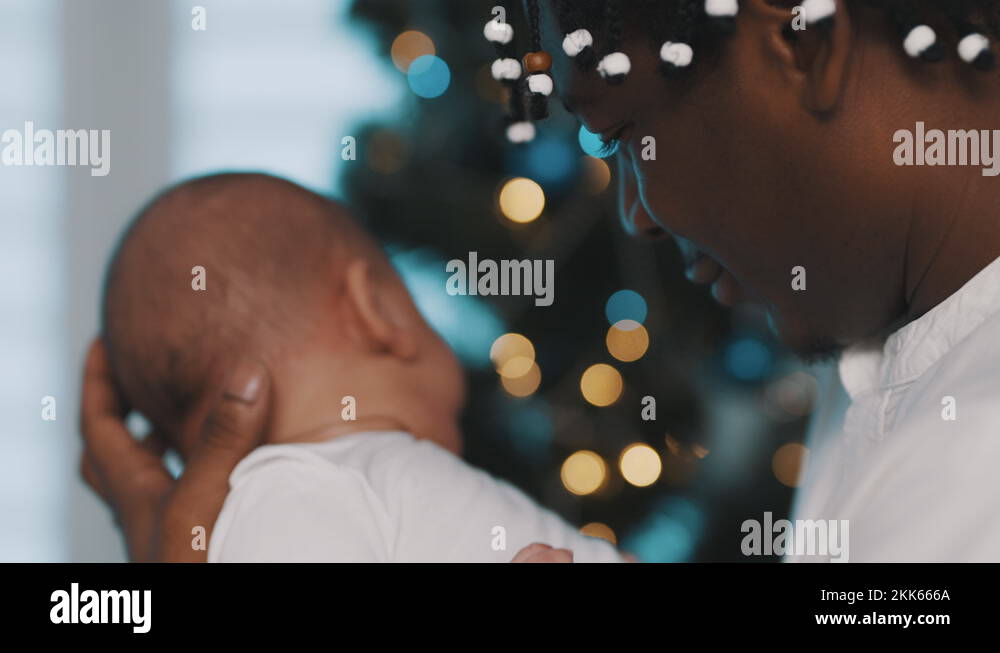 Beautiful multiracial family. Young black father holding his mulatto ...