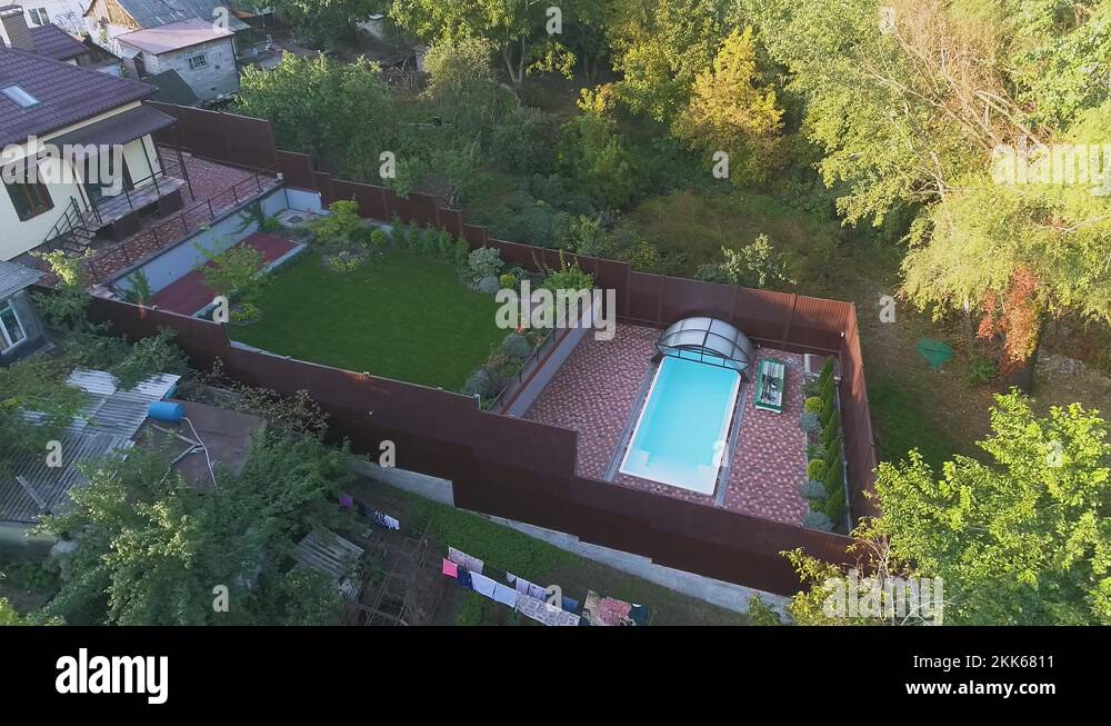 Beautiful modern cottage top view. Flight over a small cottage with a ...