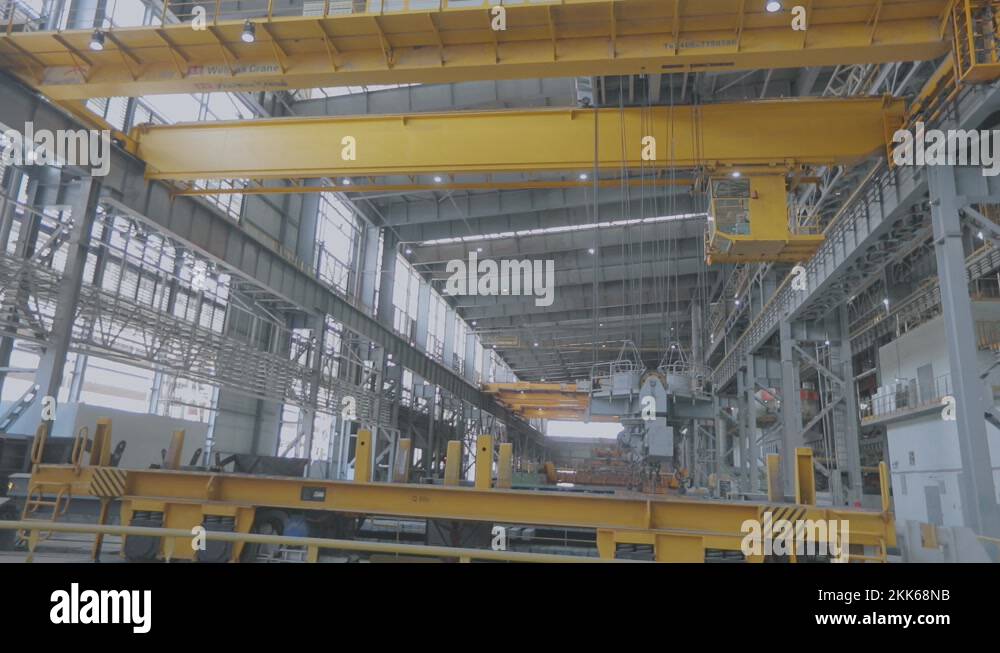 An overhead crane in the workshop is loading. A modern overhead crane ...