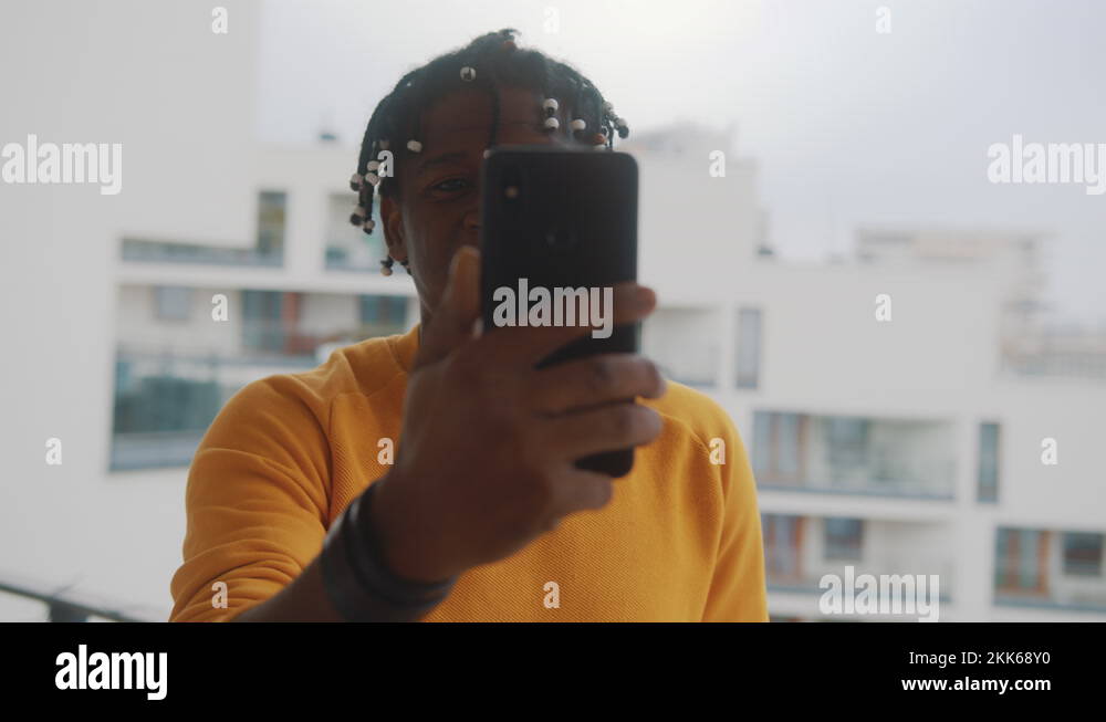 Video call. African american black man with dreadlocks having video ...