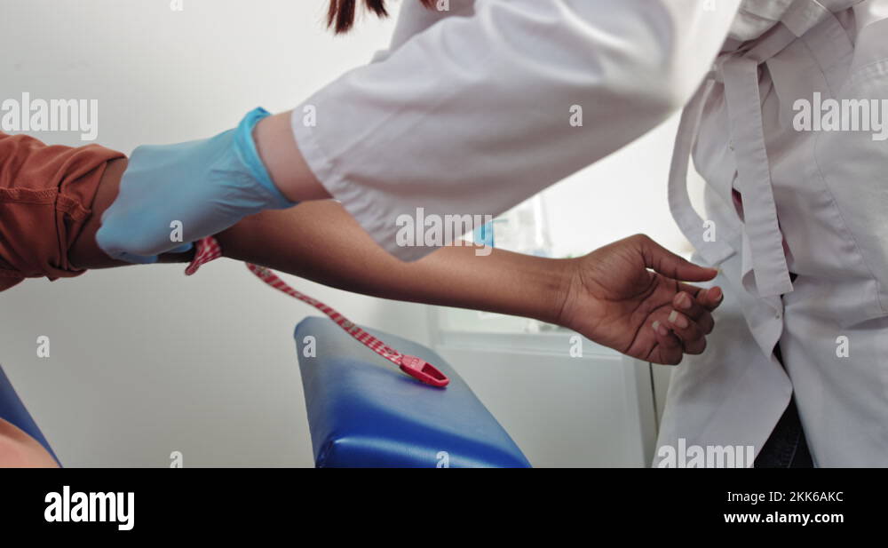 laboratory in clinic. Female lab assistant taking venous blood for test ...
