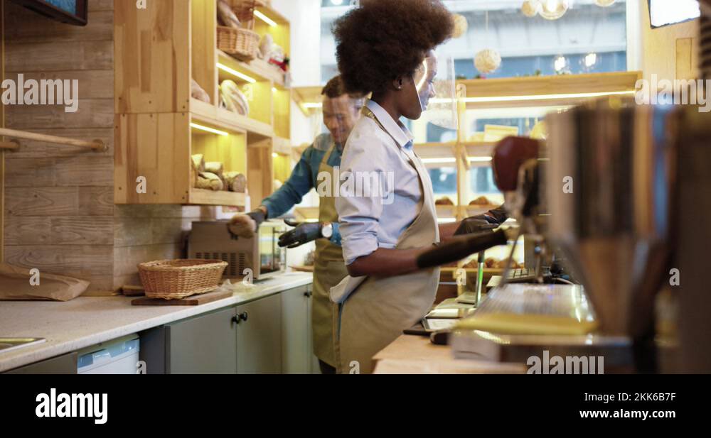 Man and woman standing at counter of cafeteria Stock Videos & Footage ...