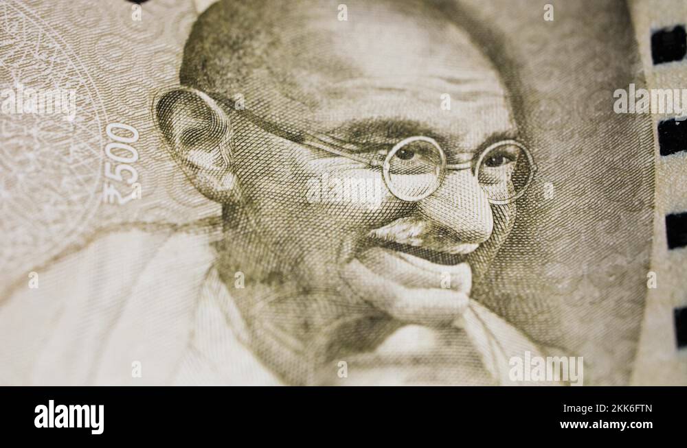 Extreme close up of an Indian Rupee bill with face of Mahatma Gandhi ...