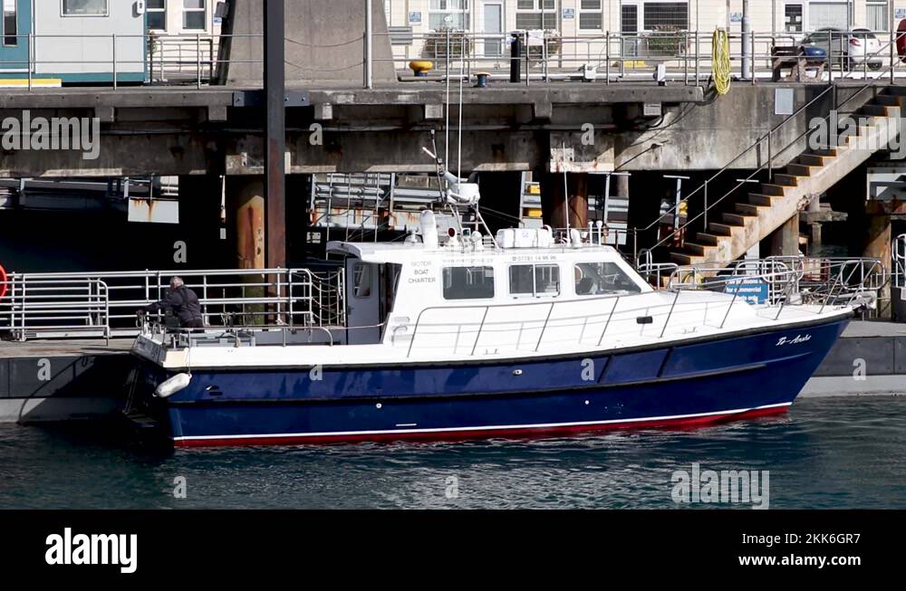 Charter boat tying alongside Cambridge Berth St Peter Port Harbour ...