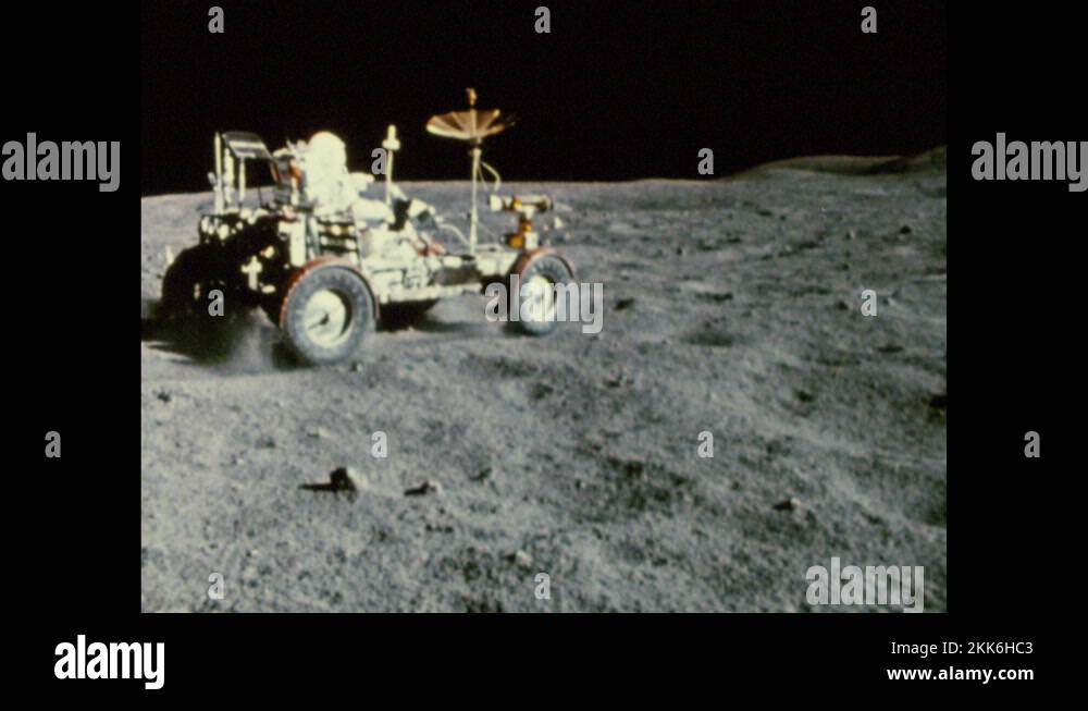 1980s: Robot undergoes test. Astronauts ride buggy on moon. Man in lab ...