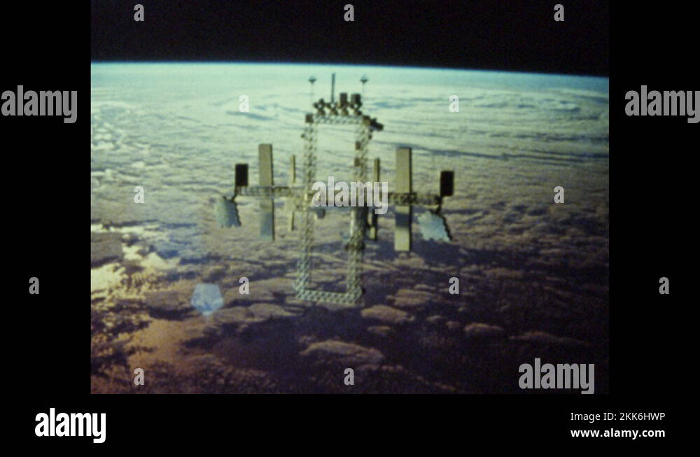 1980s: model of space station with space shuttle docked rotates above ...