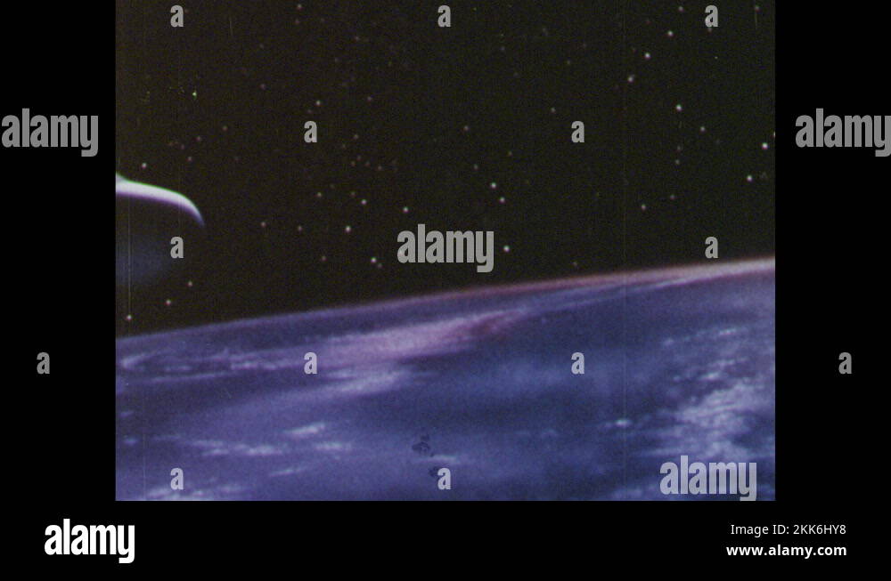 1960s: Rocket ship in orbit around Earth. Rocket ship separates into ...