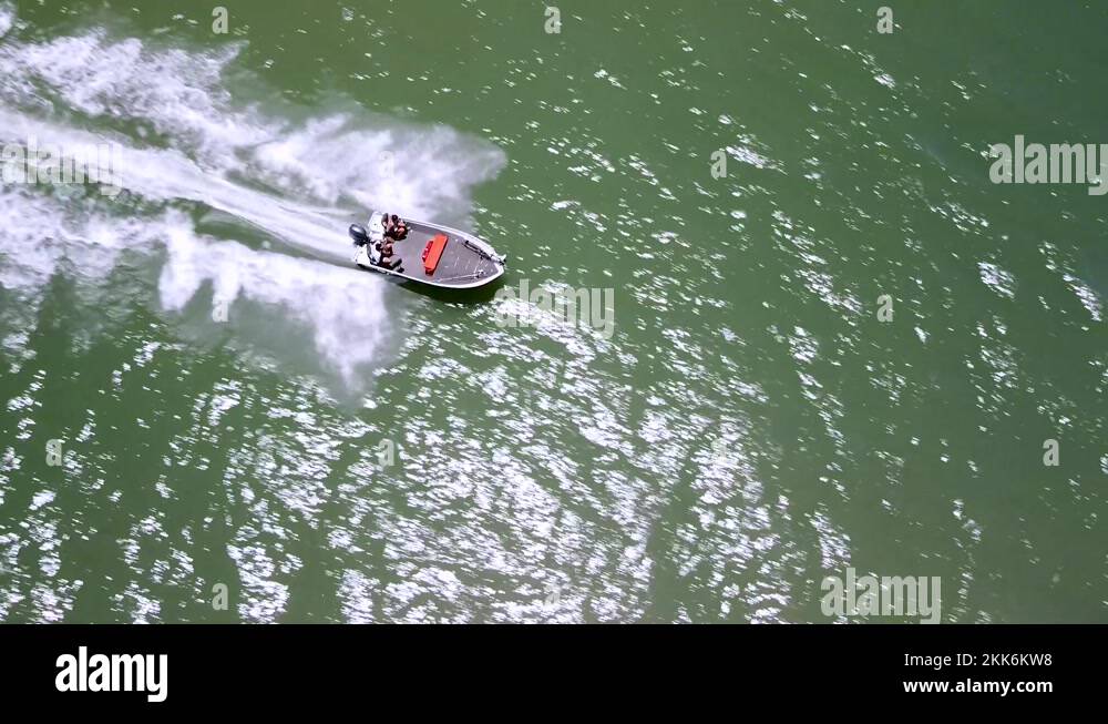 Aerial Overhead View Of Speeding Boat Across Ocean Off Trinity Beach In ...