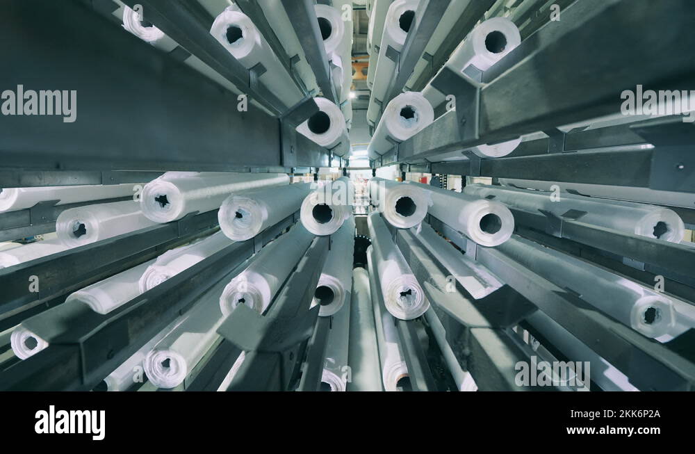 Inside view of a factory mechanism transporting paper rolls Stock Video ...