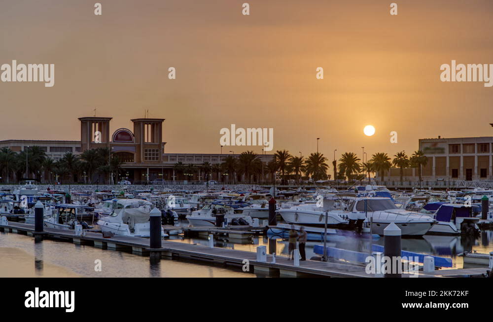 Yachts and boats at the Sharq Marina at sunset timelapse in Kuwait ...