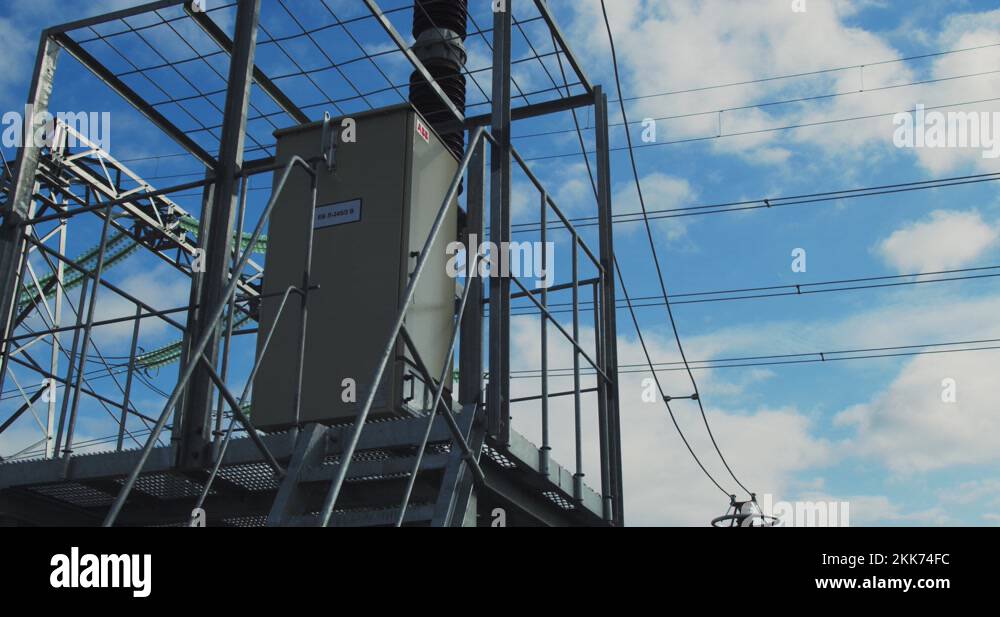 Transformer at the power plant, metal structures and power lines ...