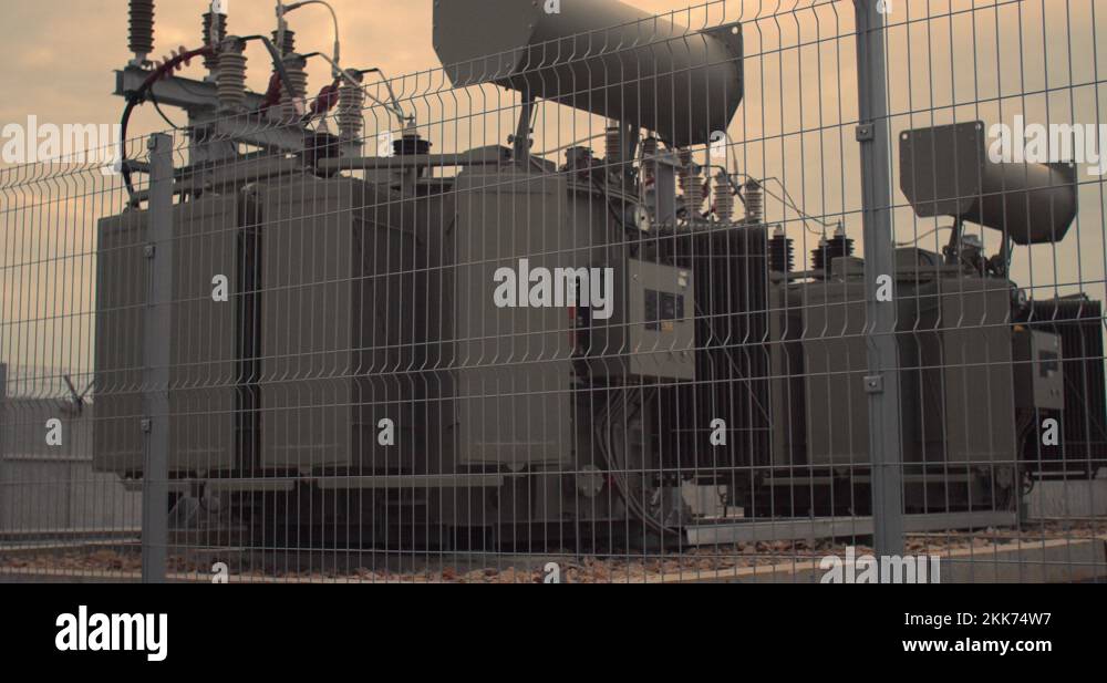 Big transformer at the power station behind the metal fence, 4k Stock ...