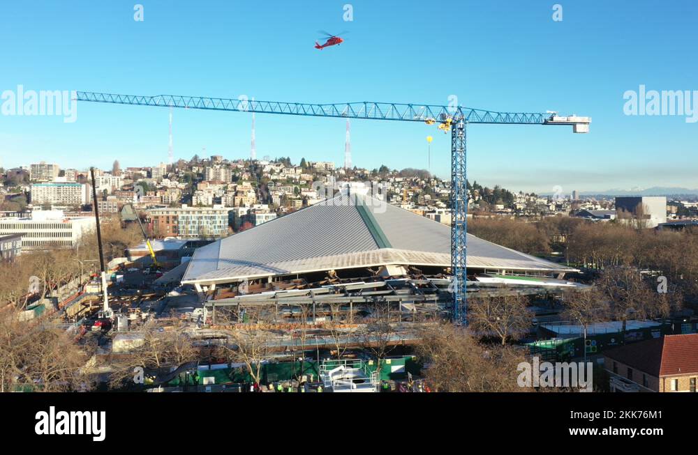 Birdseye view of the Climate Pledge Arena's new signage getting lifted ...