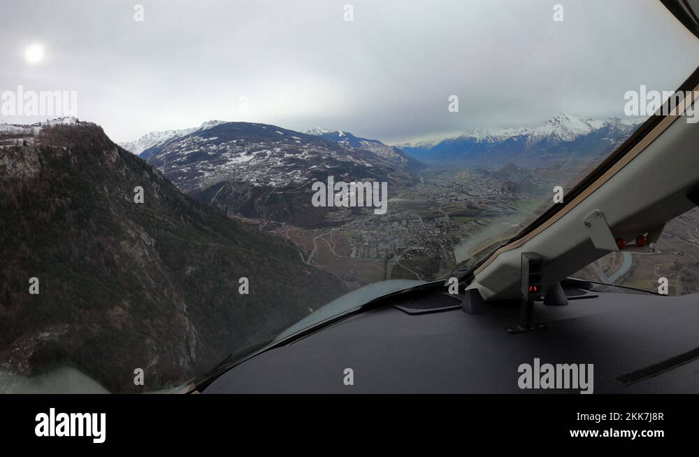 Pilots view of jet approaching airport in Sion Valley in the alps Stock ...