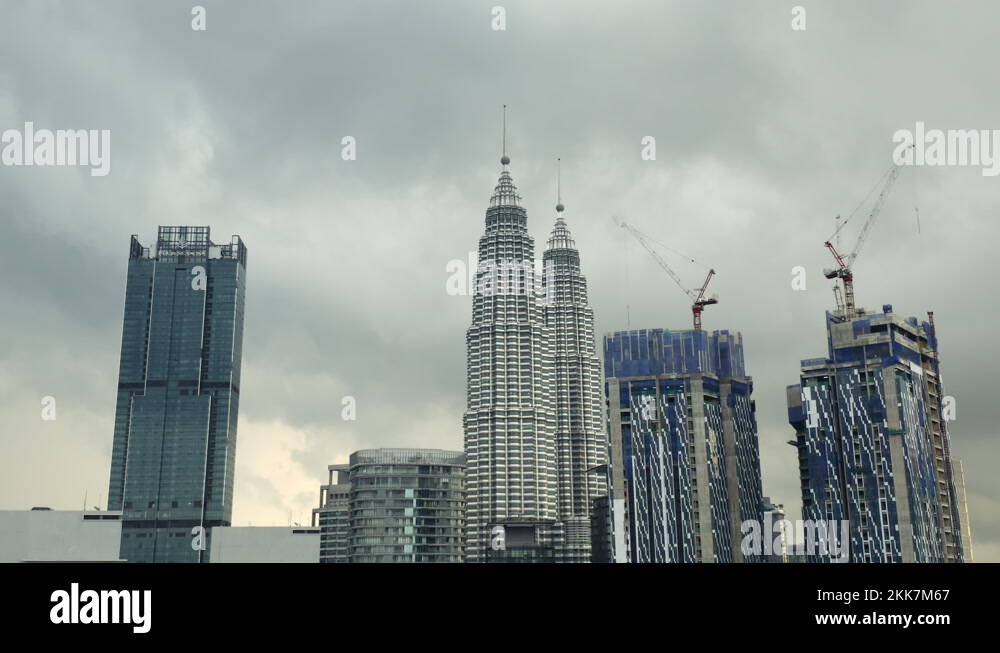 Petronas Twin Towers,construction cranes,Kuala Lumpur,Malaysia,cloudy ...